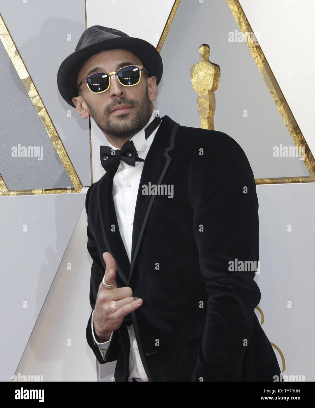Director JR arrives on the red carpet for the 90th annual Academy ...