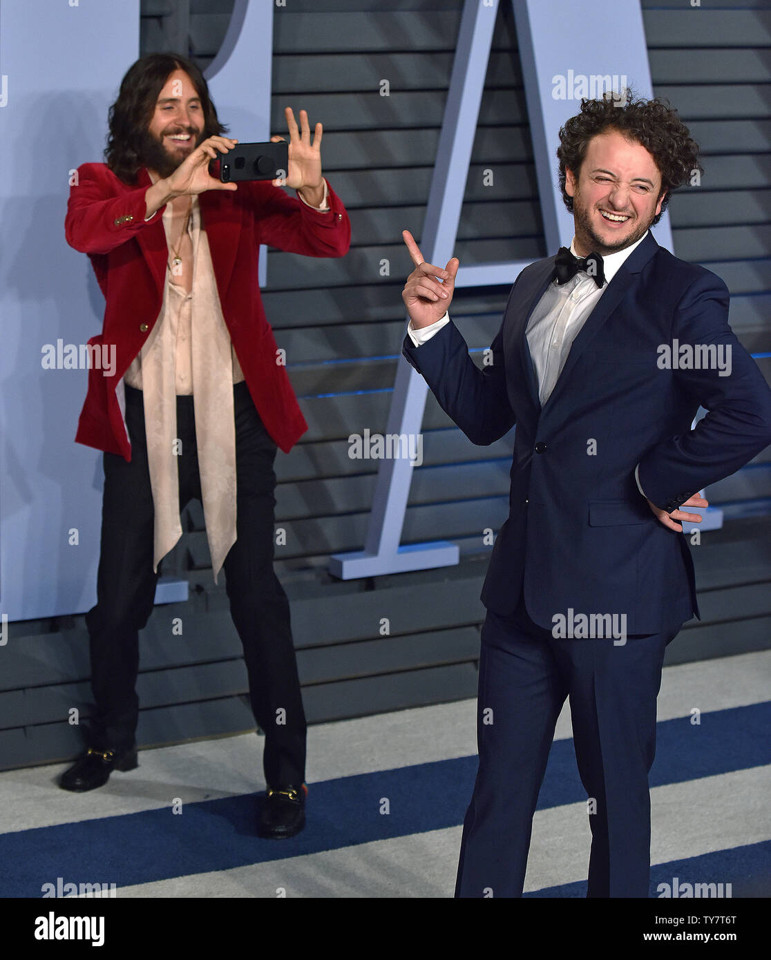 Jared Leto (L) takes a photo of Jason Clarke as they arrive for the ...