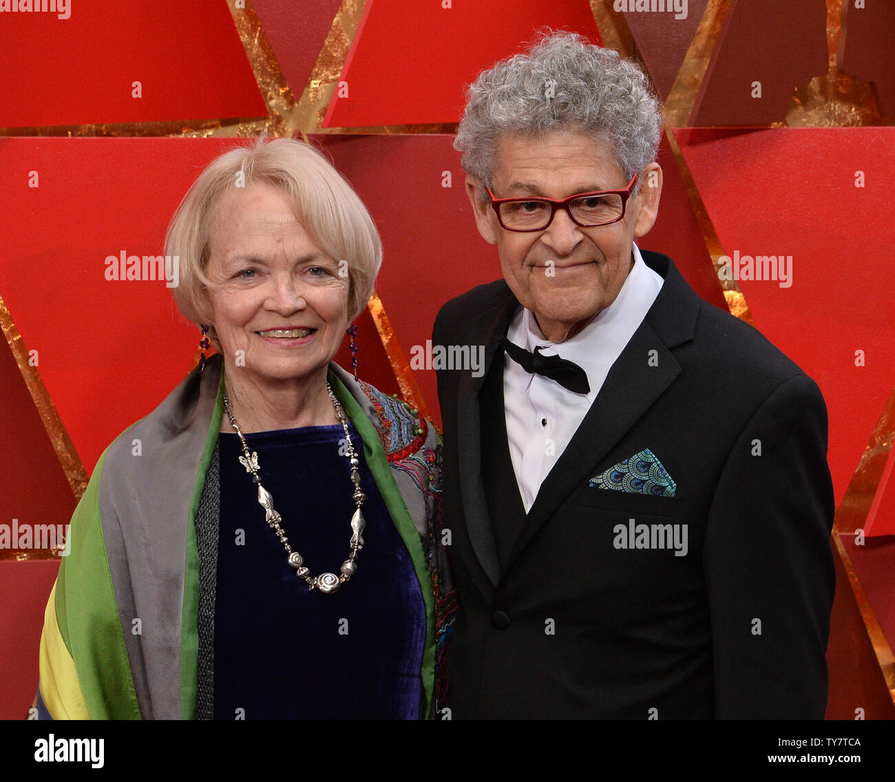 Film editor Sidney Wolinsky and guest arrive on the red carpet for the ...