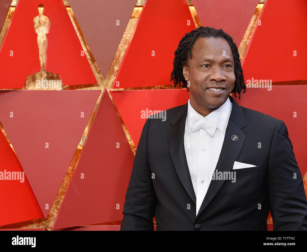 Television director Roger Ross Williams arrives on the red carpet for ...