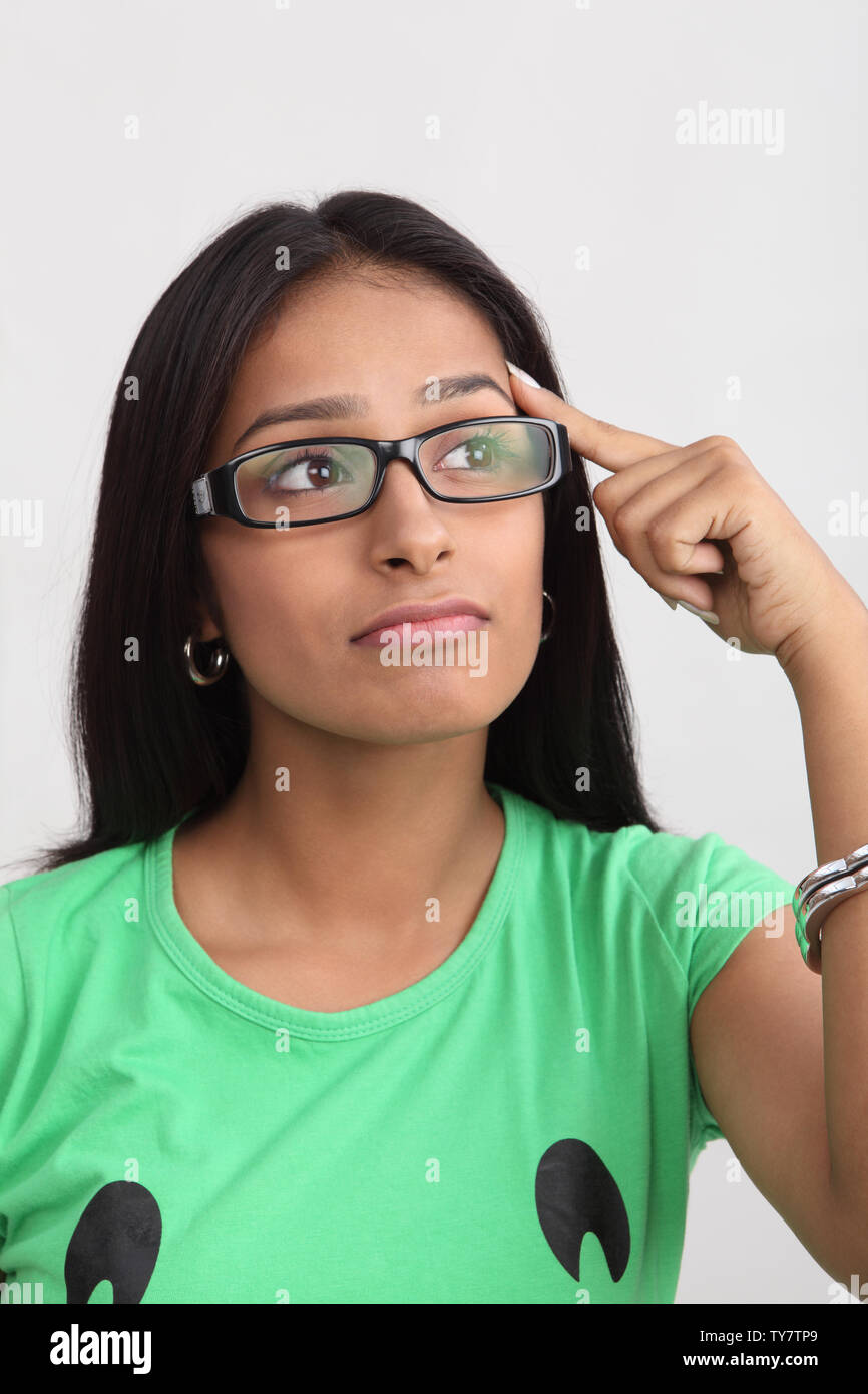 Close up of an Indian woman thinking Stock Photo - Alamy
