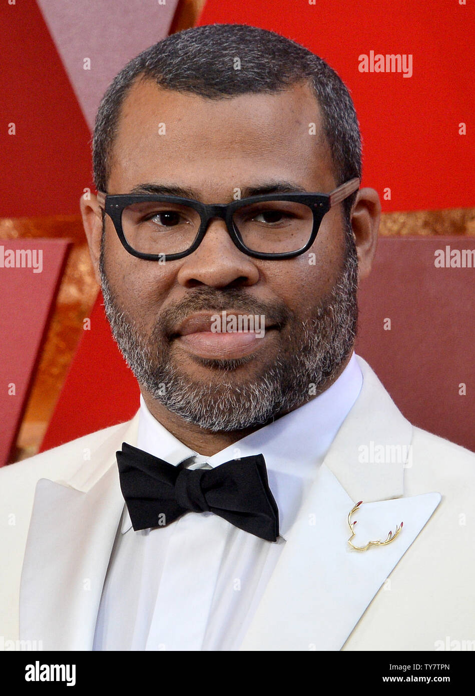 Director Jordan Peele arrives on the red carpet for the 90th annual ...
