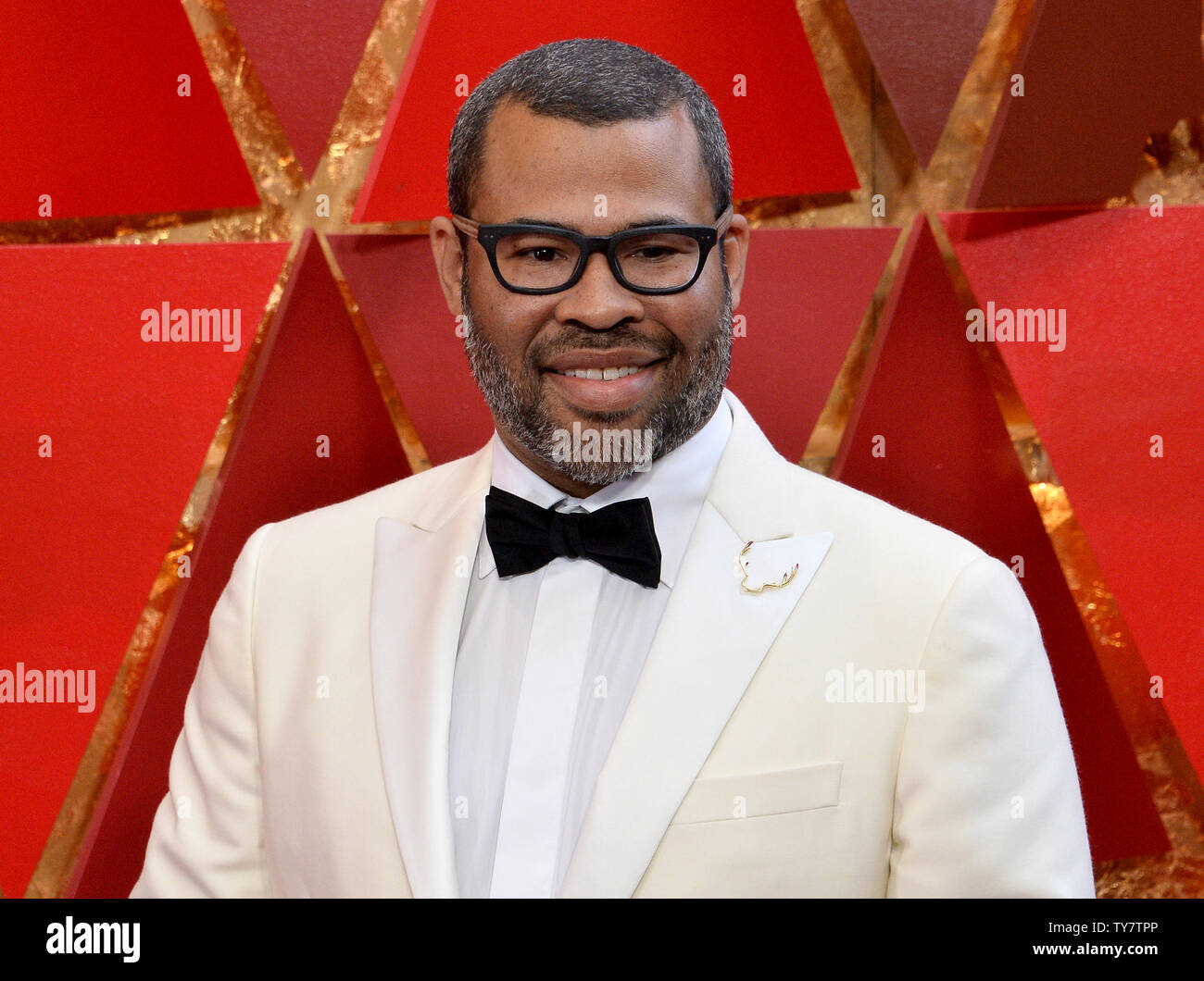 Director Jordan Peele arrives on the red carpet for the 90th annual ...