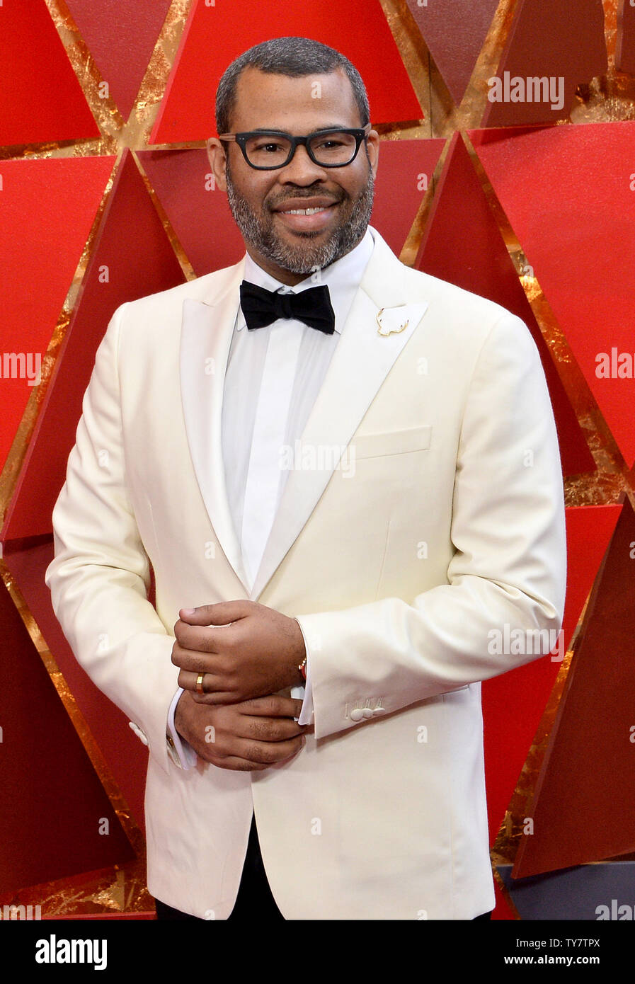 Director Jordan Peele arrives on the red carpet for the 90th annual ...