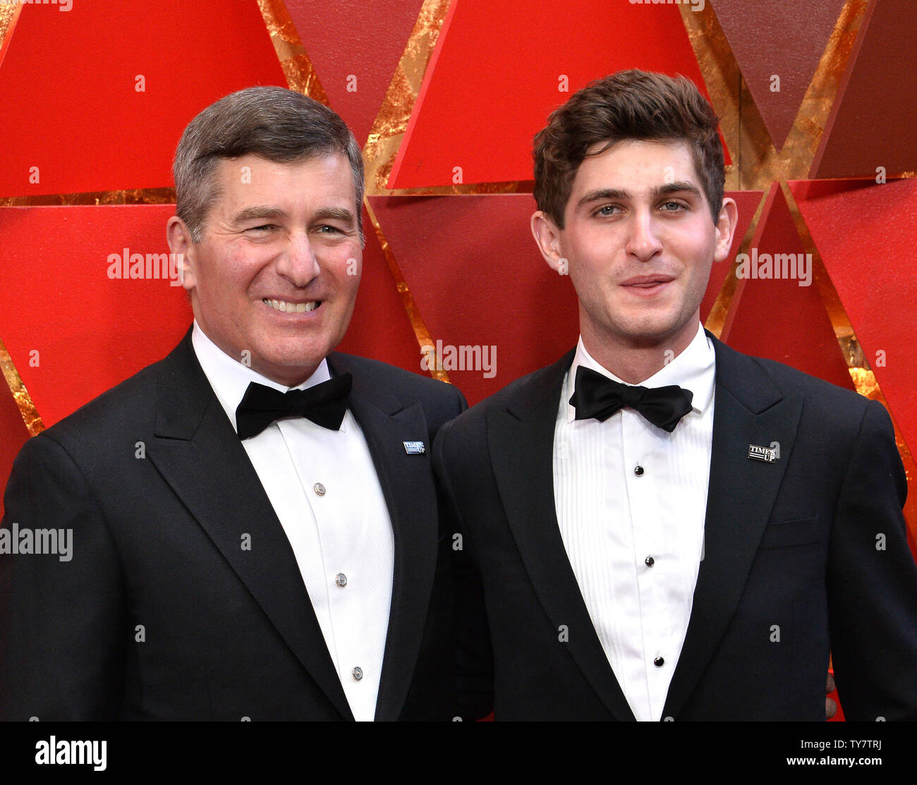 Charles Rivkin (L) and Eli Rivkin arrive on the red carpet for the 90th ...
