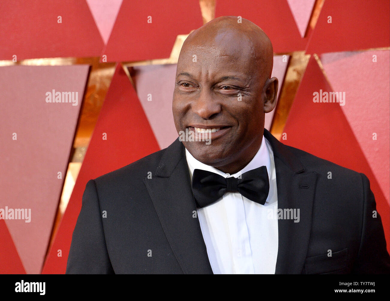 Director John Singleton arrives on the red carpet for the 90th annual ...