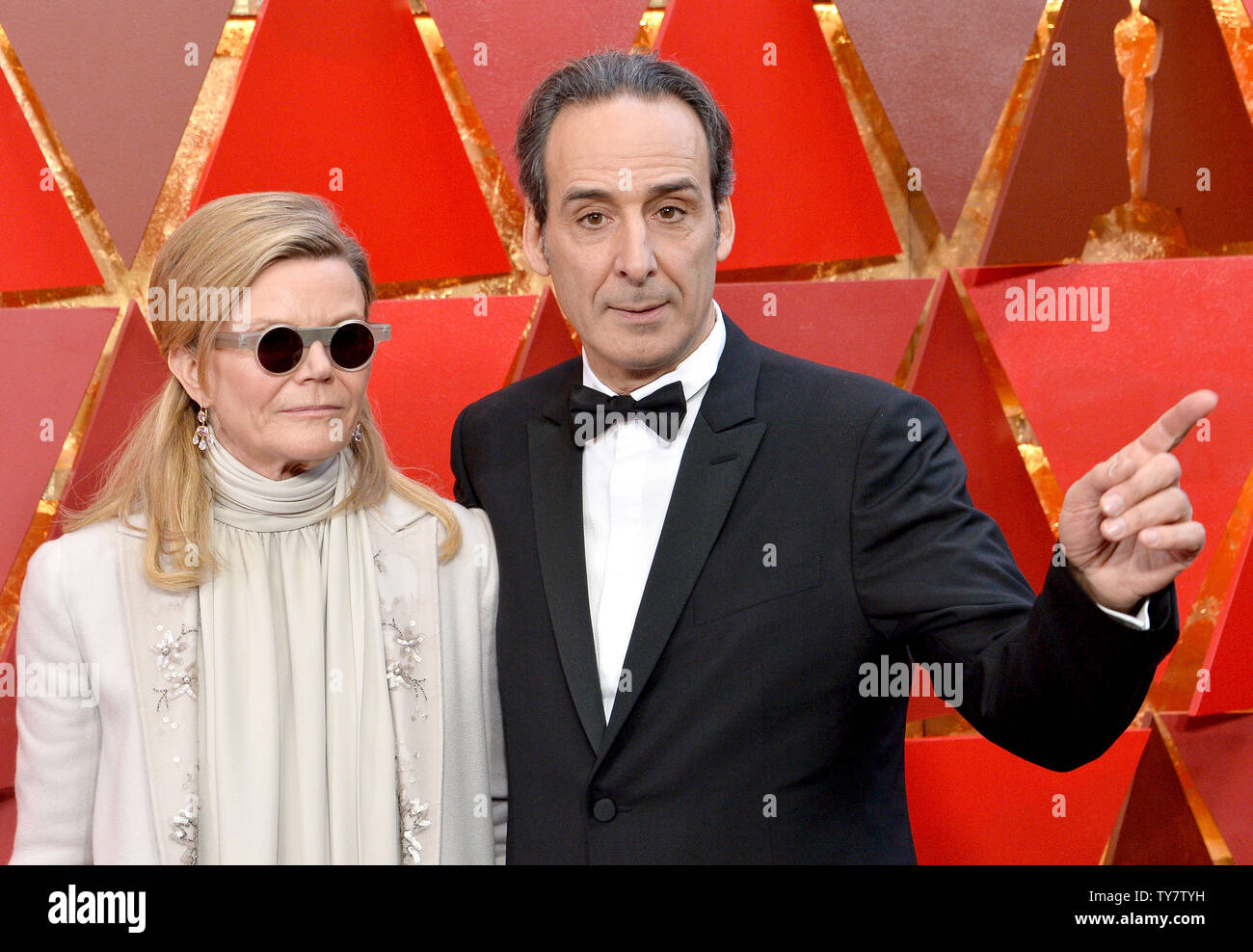 Dominique Lemonnier (L) and composer Alexandre Desplat arrive on the ...
