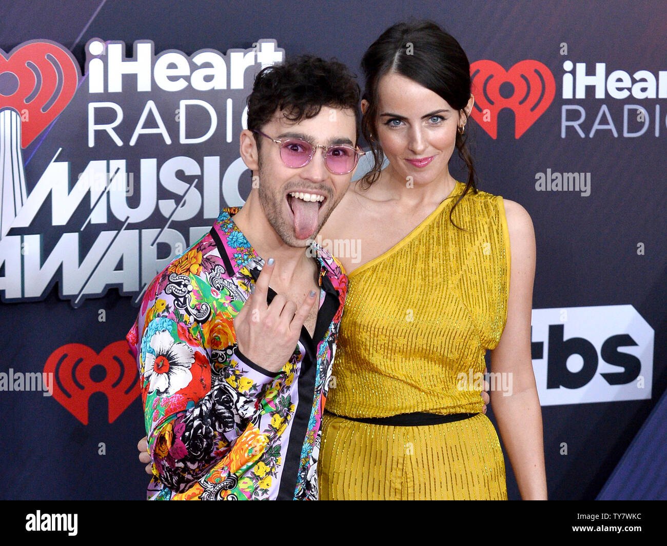 (L-R) Actors MAX and Emily Schneider arrive for the iHeartRadio Music ...