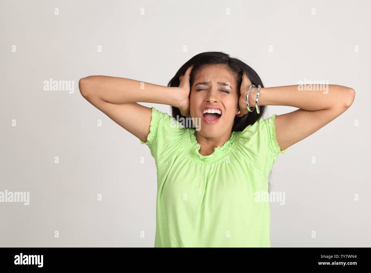 Indian woman suffering from headache Stock Photo - Alamy