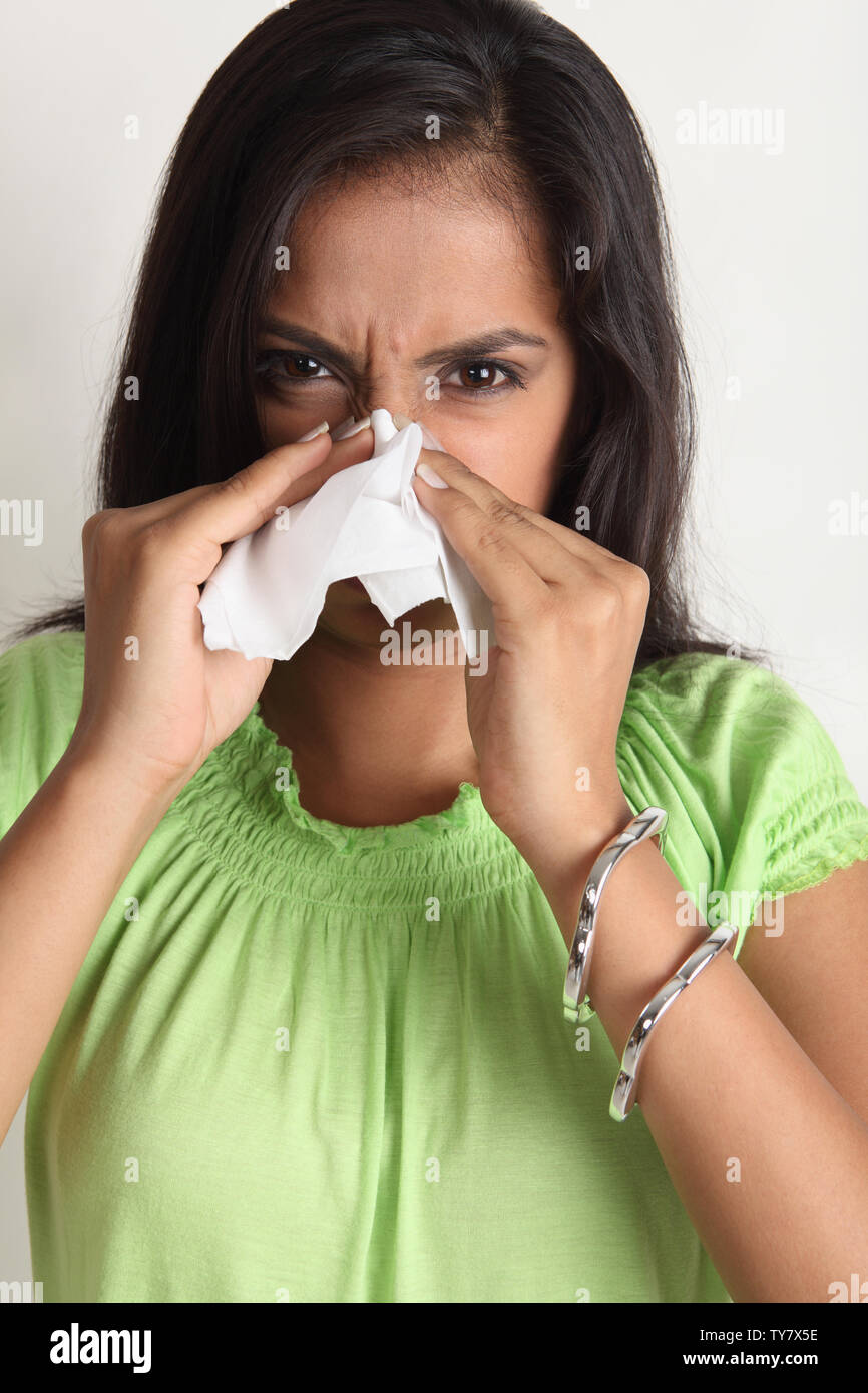 Indian woman blowing nose handkerchief hi-res stock photography and ...
