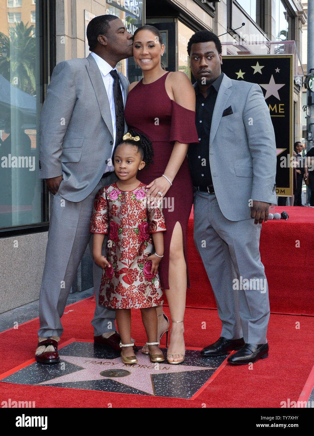 Actor Tracy Morgan (L) is joined by his wife Megan Wollover and their ...