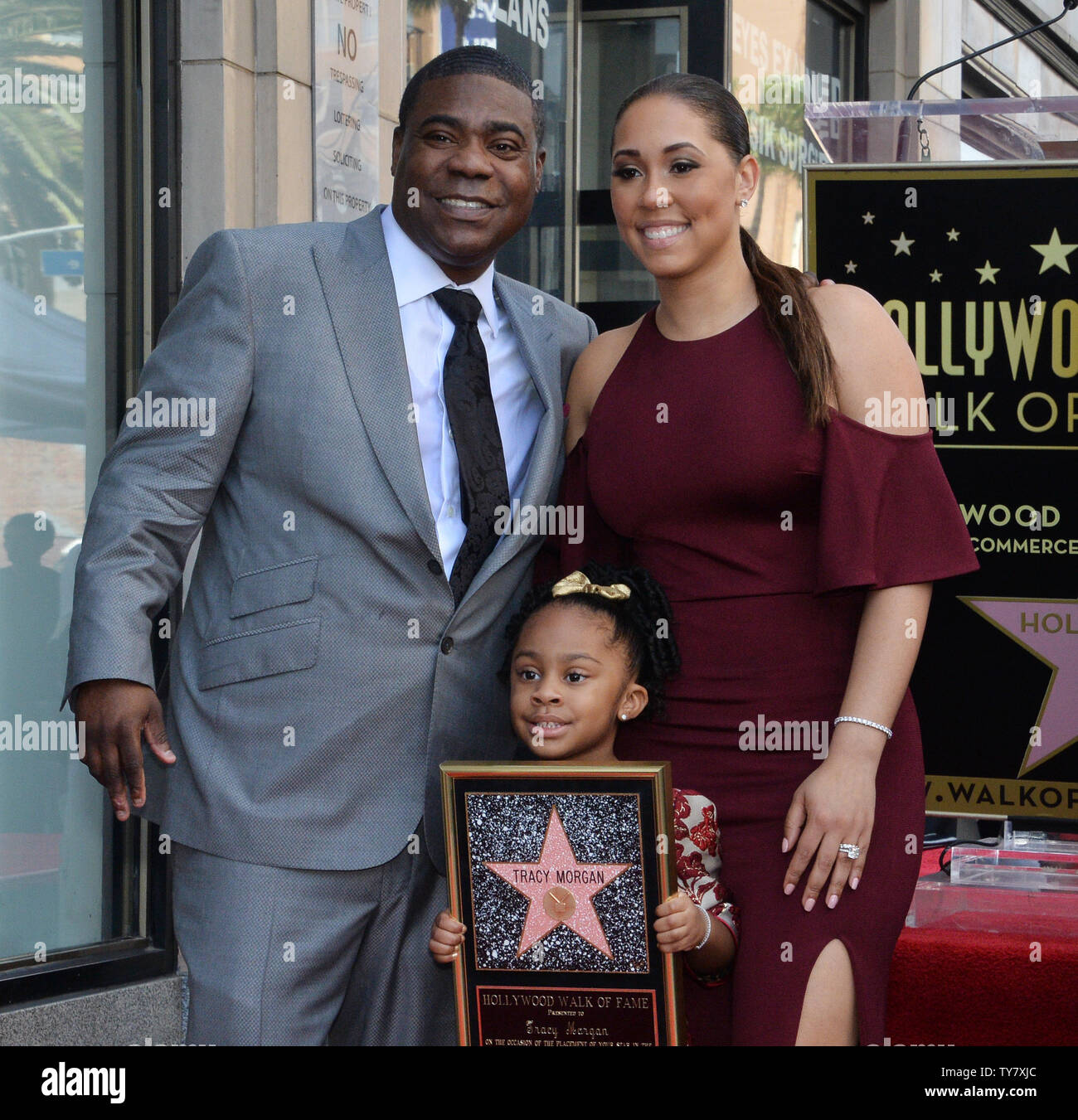 Actor Tracy Morgan (L) is joined by his wife Megan Wollover and their ...