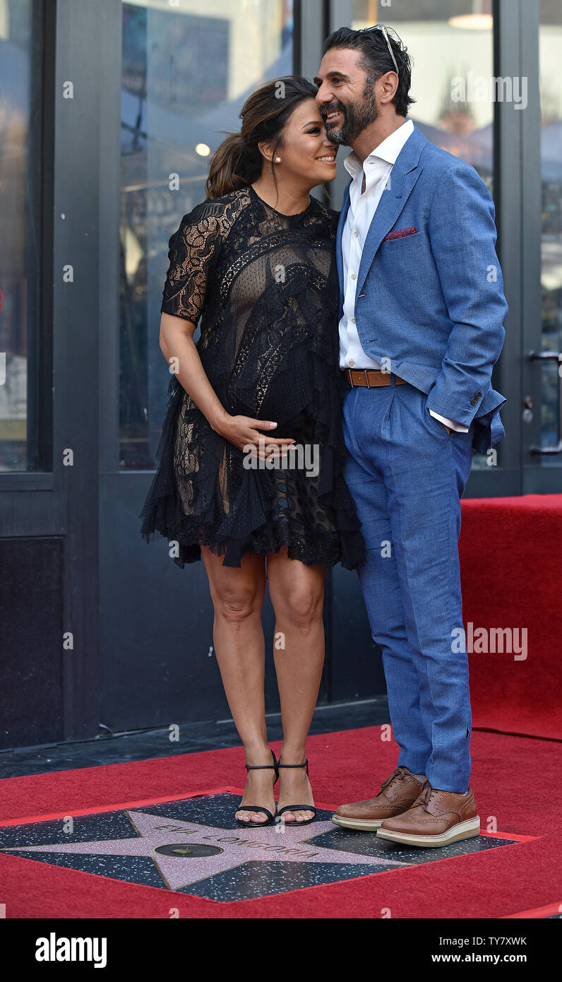 Eva Longoria (L) and her husband Jose Baston attend the star unveiling ...