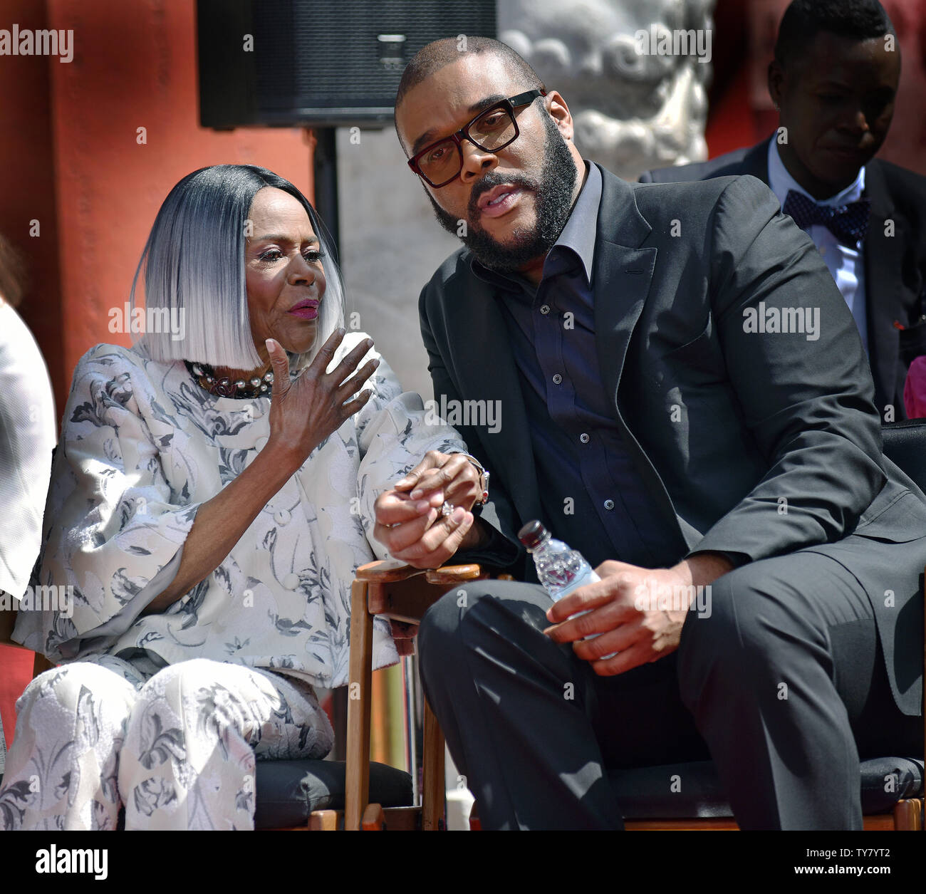 Director, screenwriter and actor Tyler Perry (R) and screen legend ...