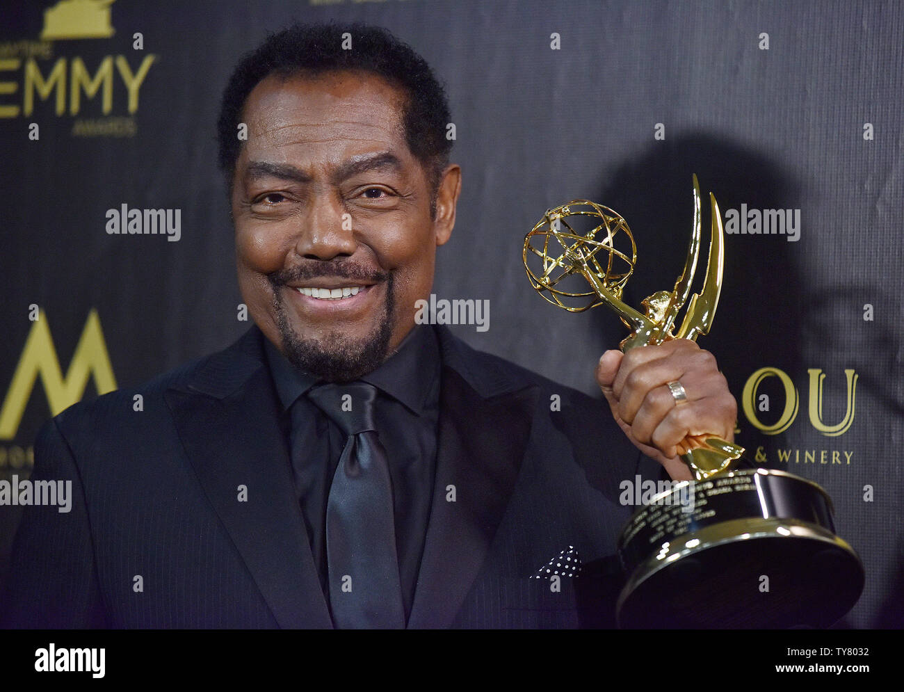 James Reynolds holds up his award for Outstanding Lead Actor in a Drama ...