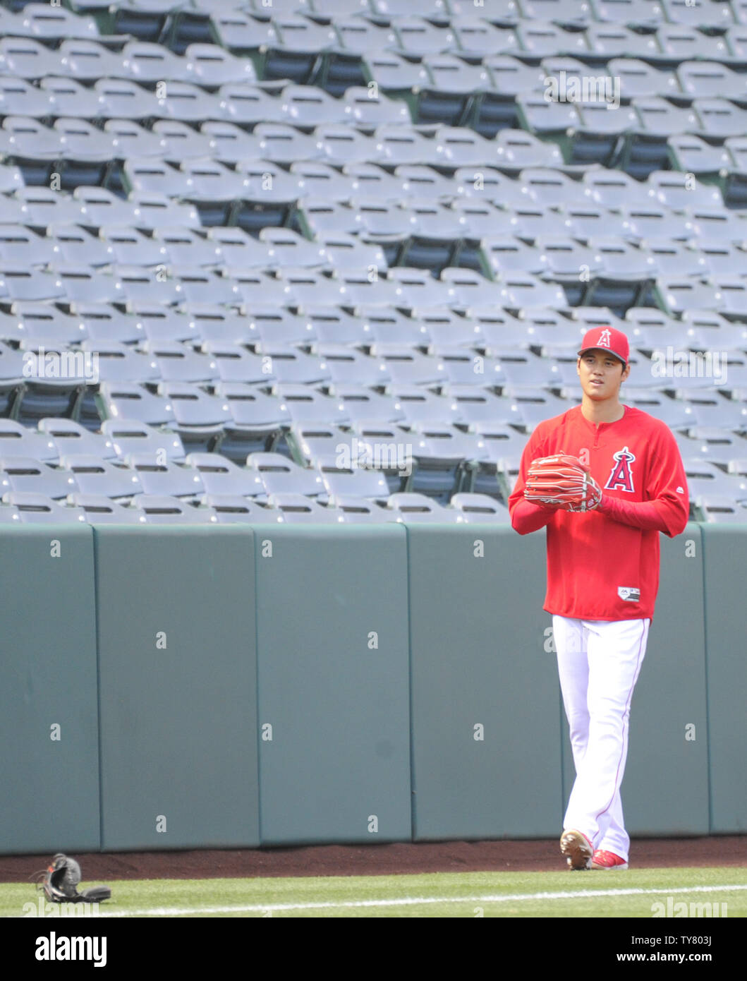 Los Angeles Angels' Shohei Ohtani walks on the field before the game ...