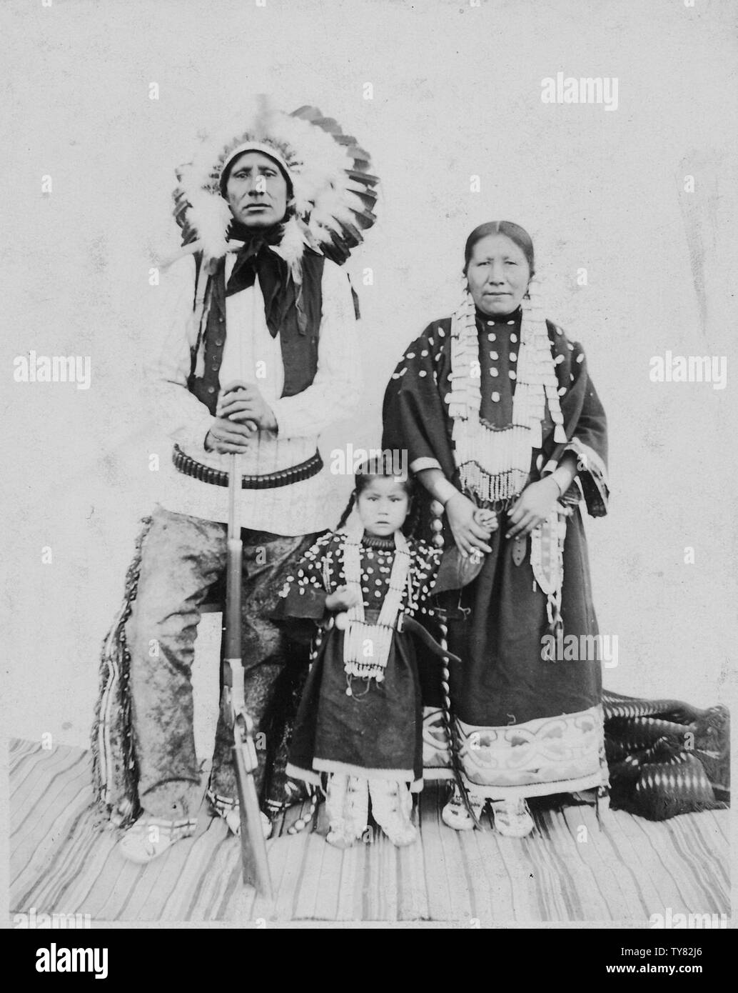 Little Chief, his wife Minnie, and son in native dress Stock Photo - Alamy