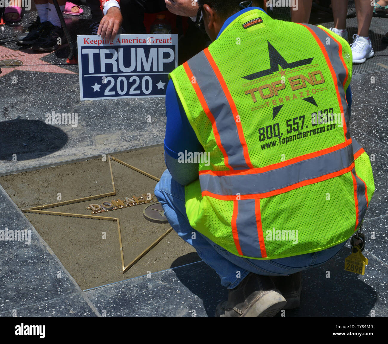 Workers replace Donald Trump's star on the Hollywood Walk of Fame after ...