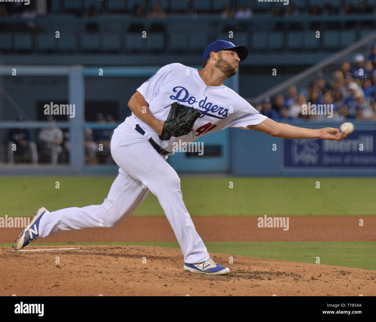 Los Angeles Dodgers' starting pitcher Rich Hill winds up to deliver in ...