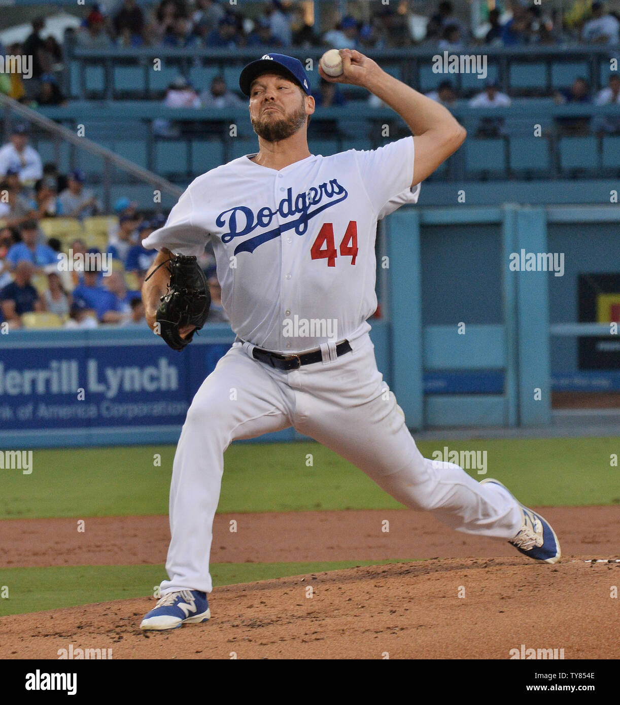 Los Angeles Dodgers' starting pitcher Rich Hill winds up to deliver in ...