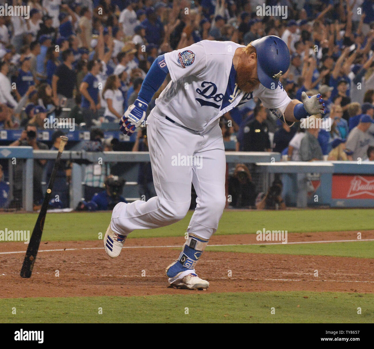 Los Angeles Dodgers' Justin Turner drops his bat after hitting the winning solo home run off ...