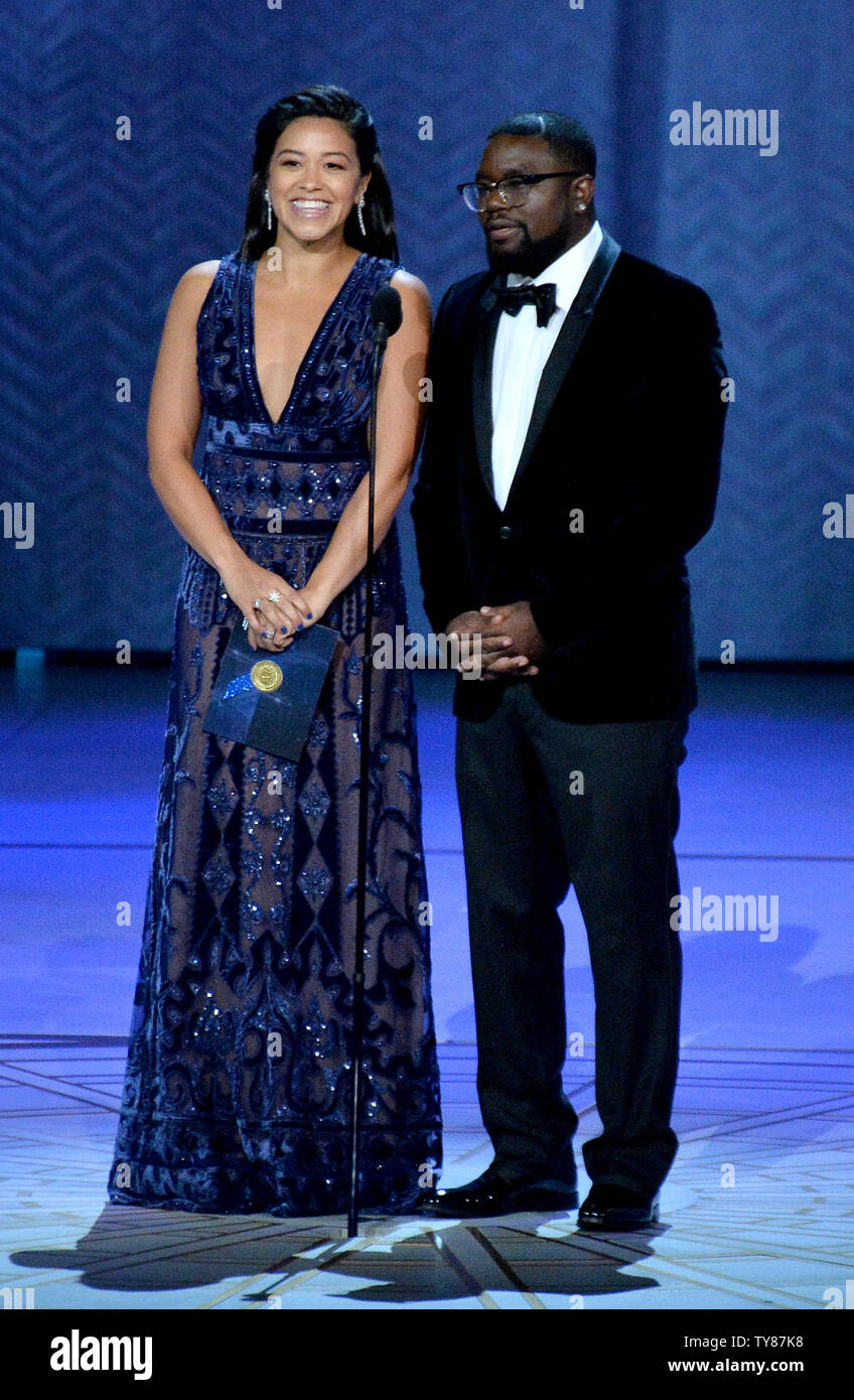 Gina Rodriguez (L) and Lil Rel Howery appear onstage during the 70th ...
