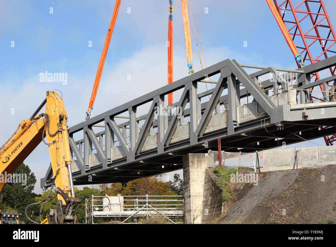 Steel section of rail lifted into place by large crane in Grafton NSW ...