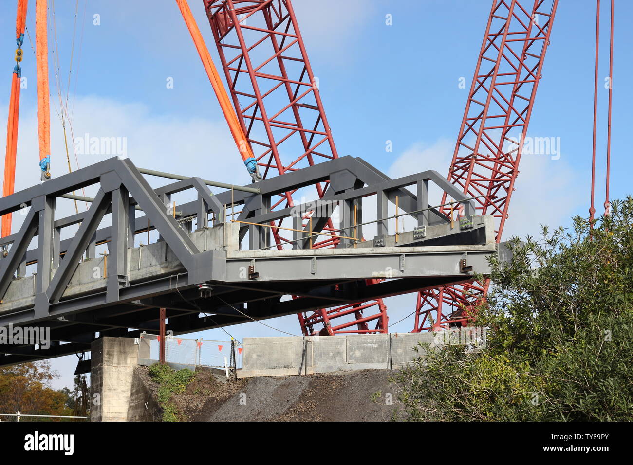 Steel section of rail lifted into place by large crane in Grafton NSW ...