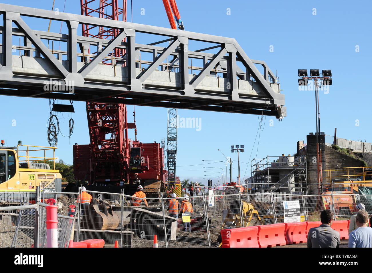 Steel section of rail lifted into place by large crane in Grafton NSW ...