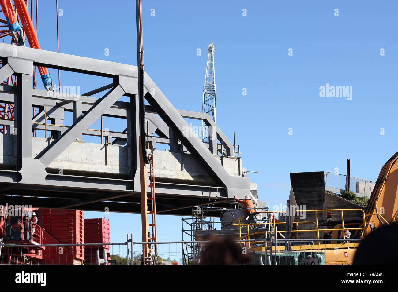 Steel section of rail lifted into place by large crane in Grafton NSW ...