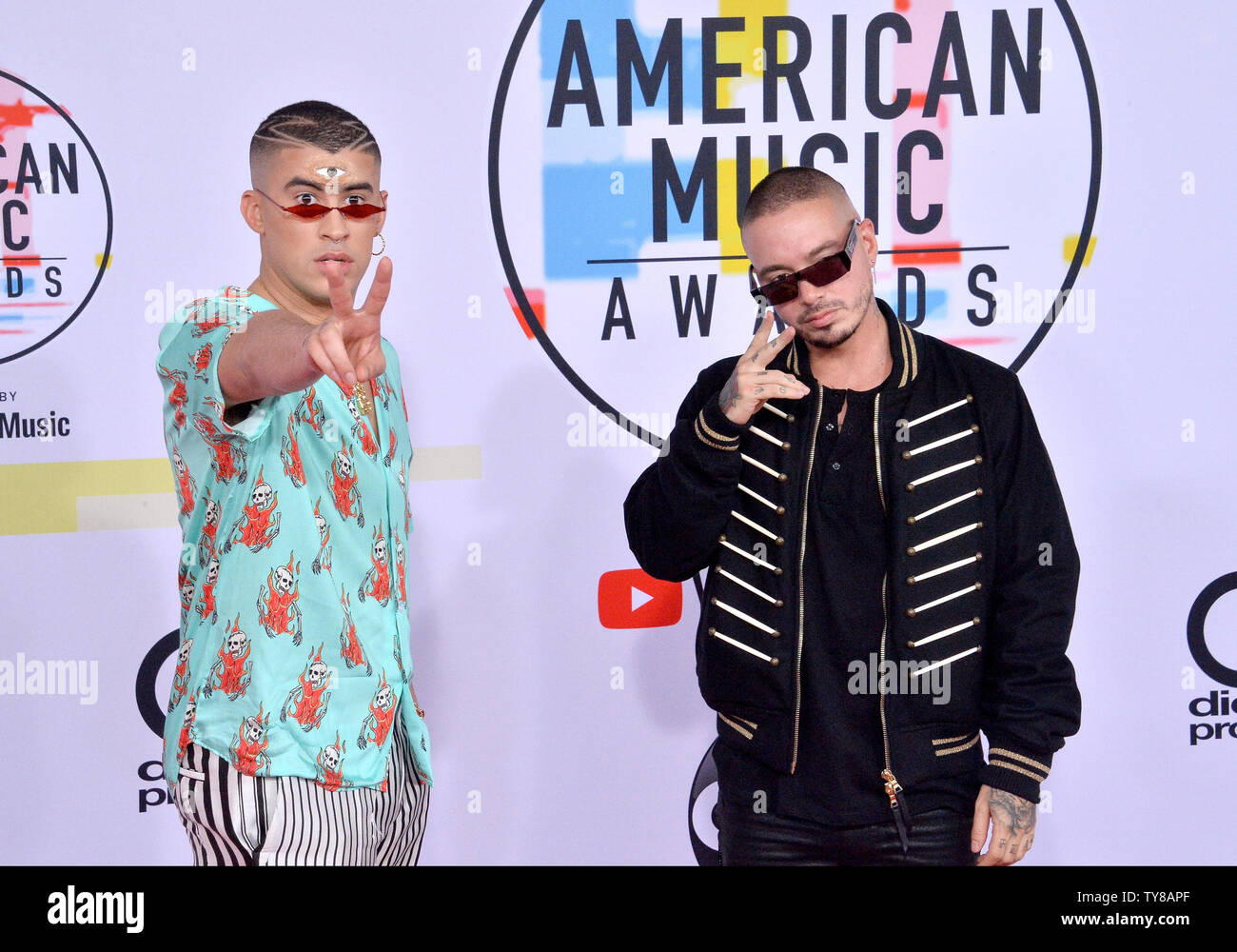 Bad Bunny (L) and J Balvin arrive for the 46th annual American Music ...
