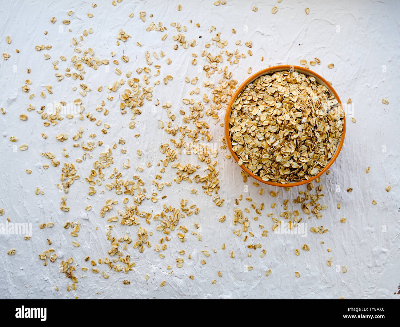 oat flakes in glass jar on table. Top view. Uncooked oatmeal Stock ...