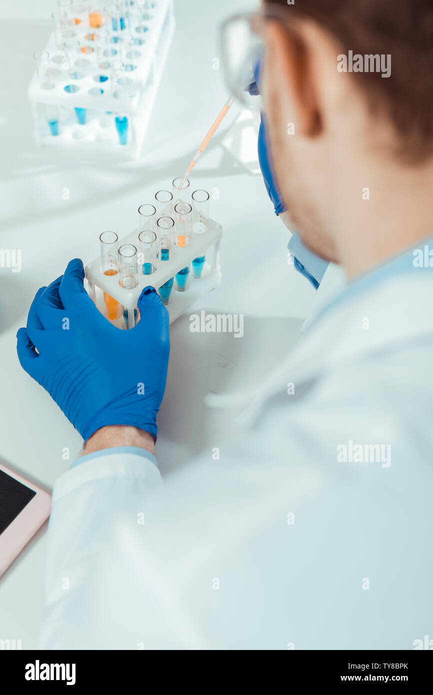 Laboratory glass tubes different liquid hi-res stock photography and ...