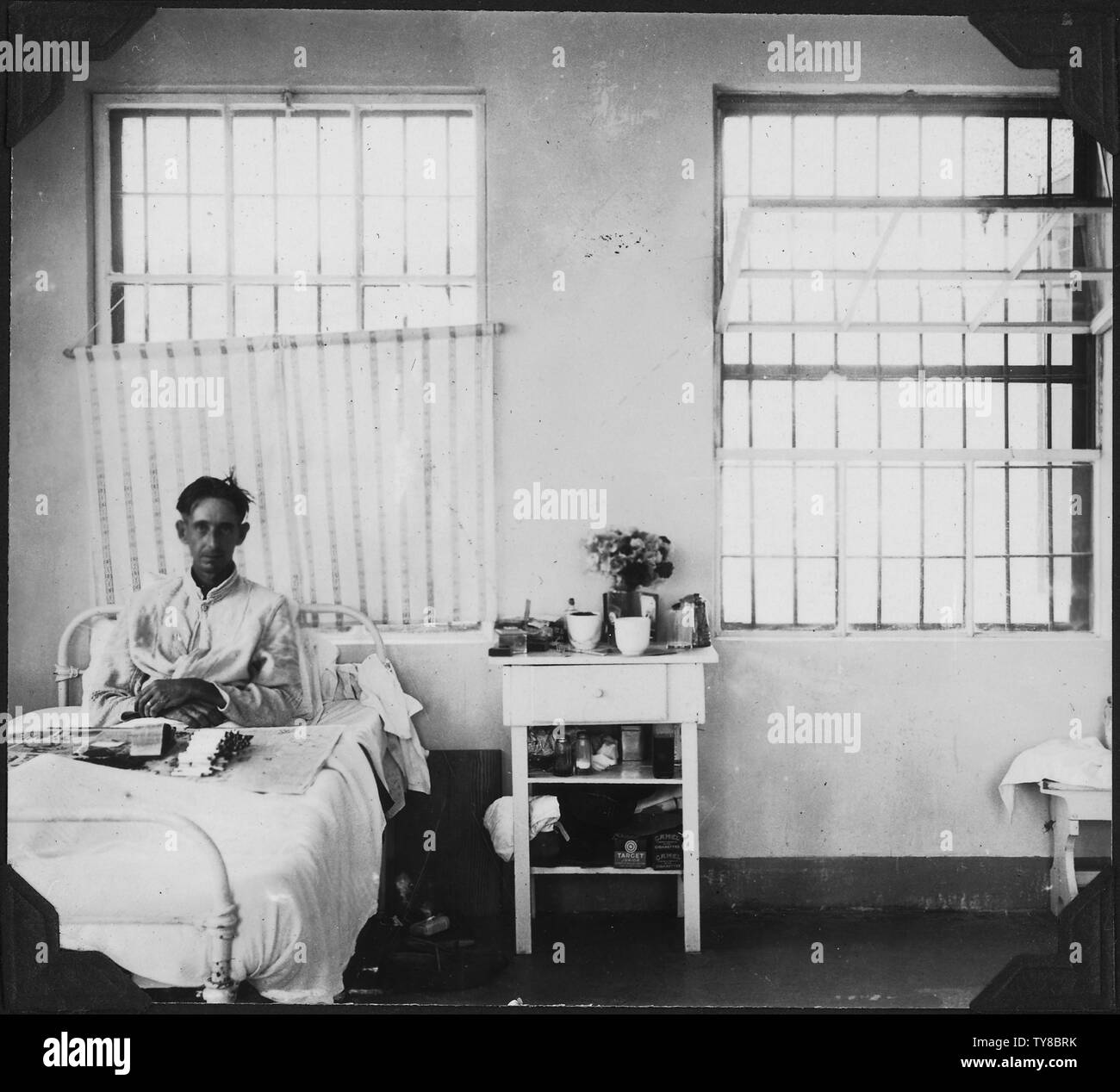 Man in hospital ward; Scope and content: The photos in the collections ...