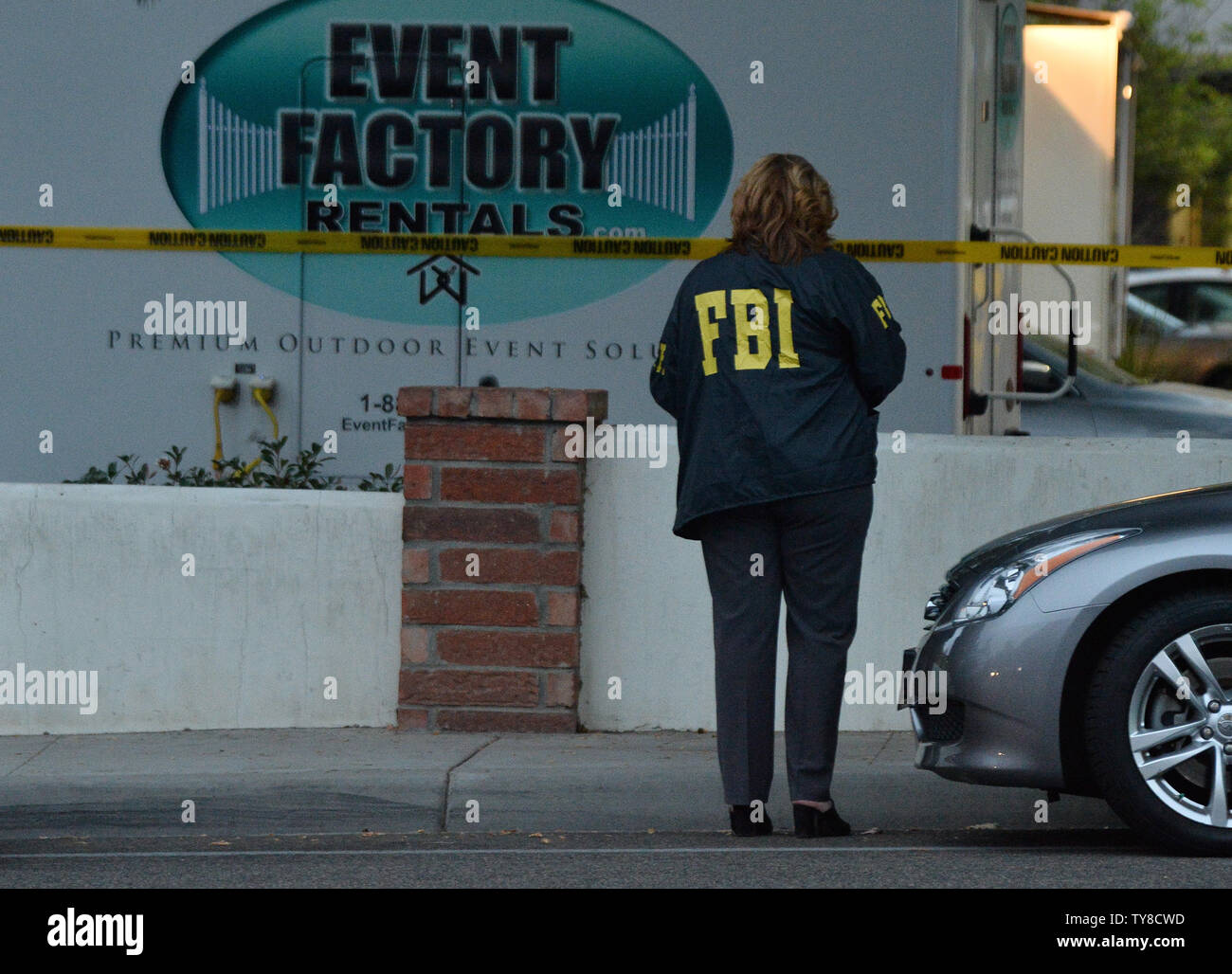 FBI personel gather in a secured area near the Borderline Bar and Grill ...
