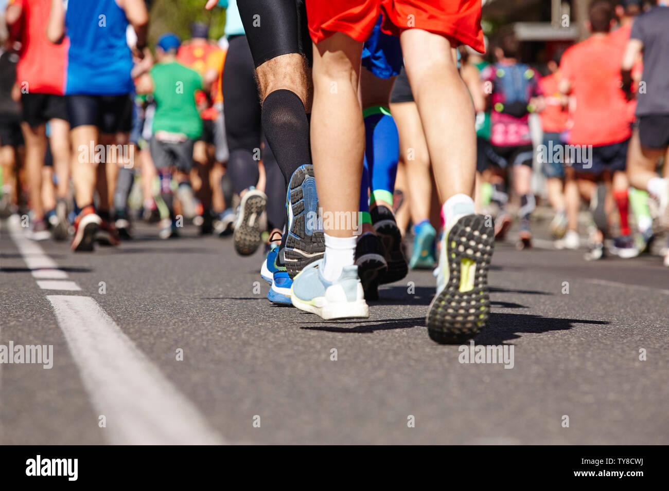 Marathon runners on the street. Healthy lifestyle. Urban athlete ...