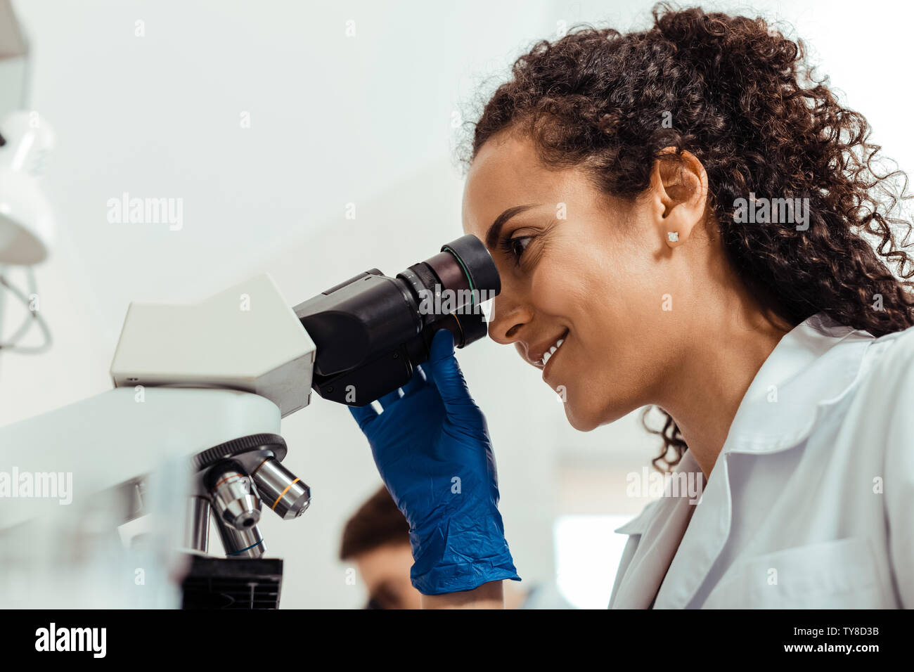 Low angle of a positive female biologist Stock Photo - Alamy