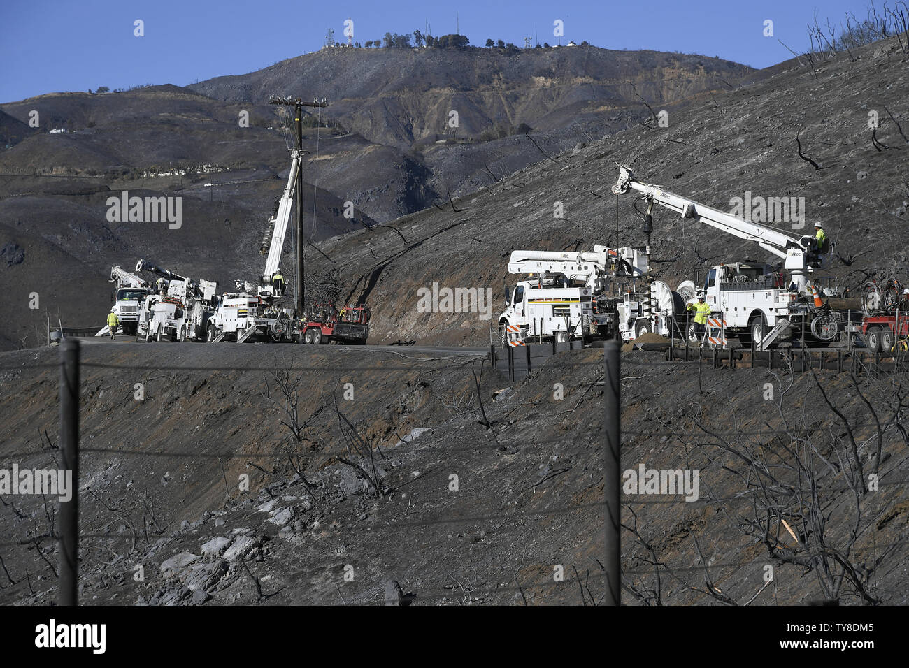Crews works to restore power lines on Latigo Canyon in Malibu ...