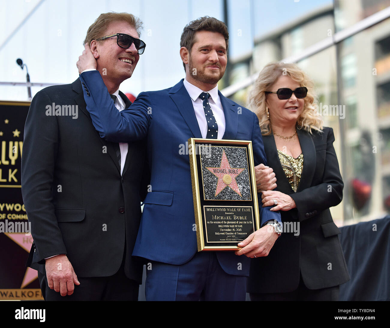 Michael Buble (center) and his parents Lewis Buble (L) and Amber ...