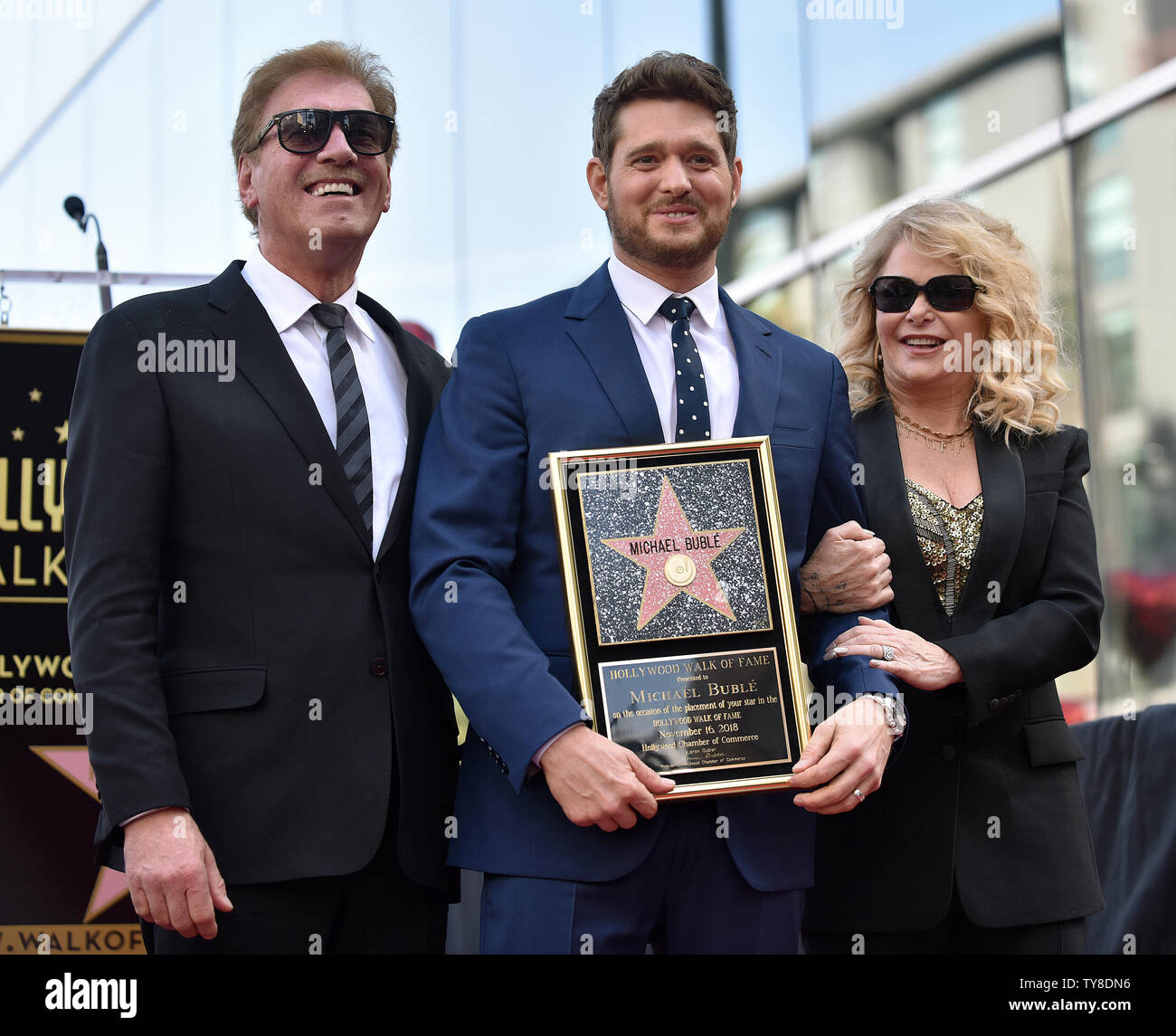 Michael Buble (center) and his parents Lewis Buble (L) and Amber ...