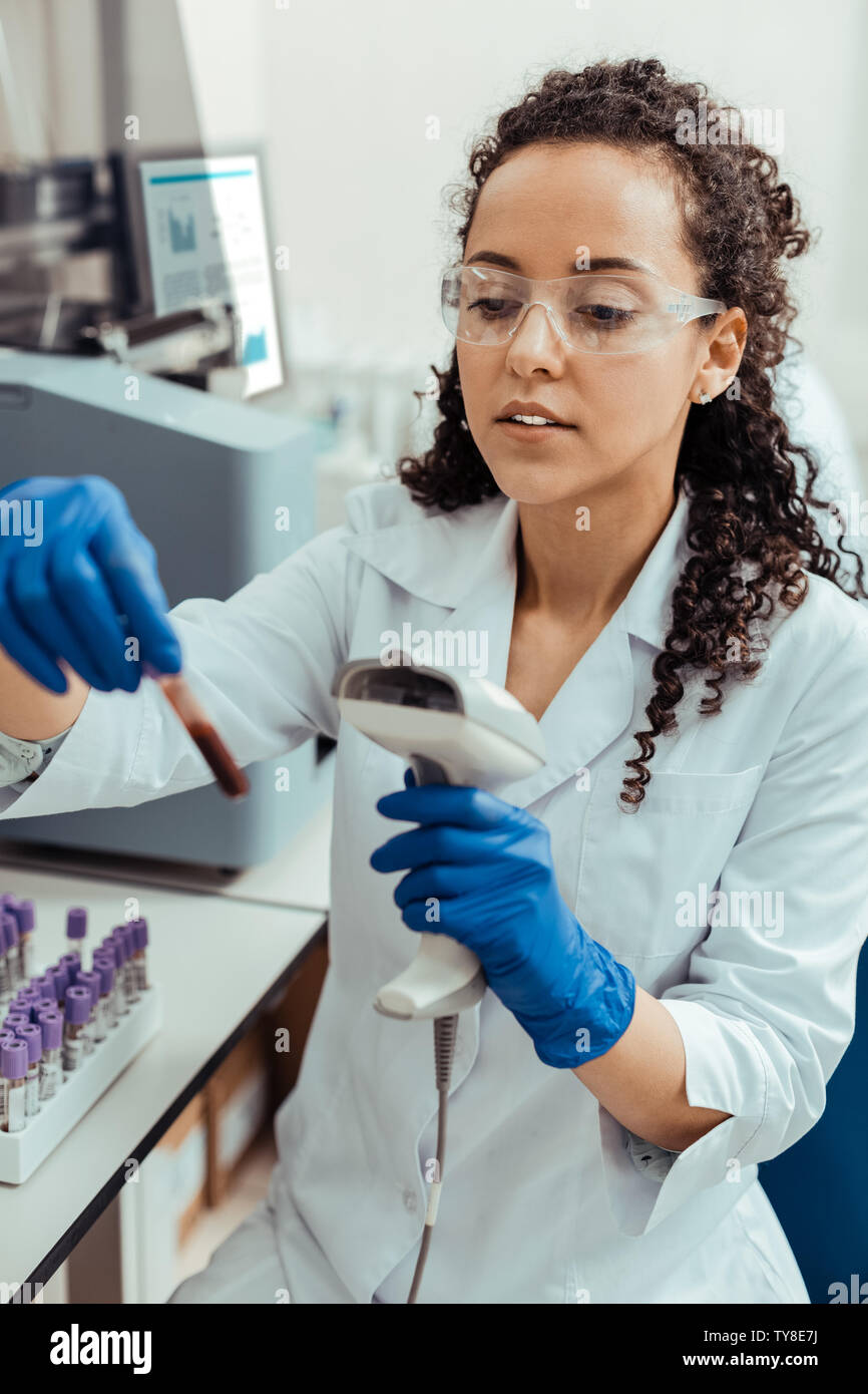 Lab assistant holding blood sample hi-res stock photography and images ...