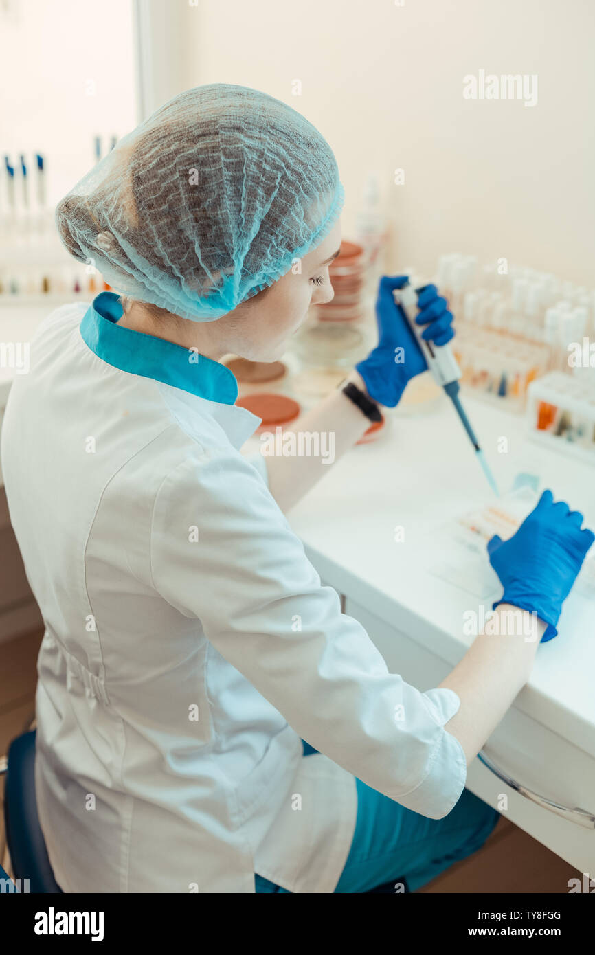 Smart intelligent lab worker doing an important work Stock Photo - Alamy