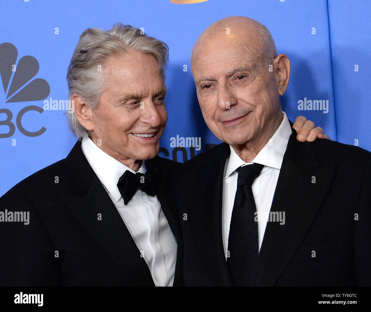 Actors Michael Douglas (L) and Alan Arkin appear backstage during the ...