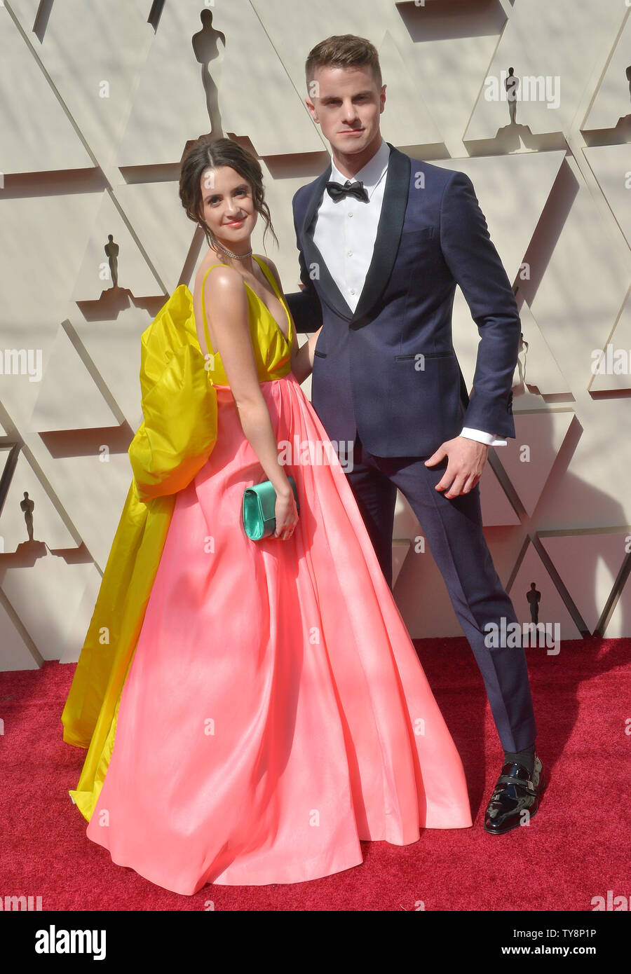 Laura Marano and Louis Virtel arrive on the red carpet for the 91st ...