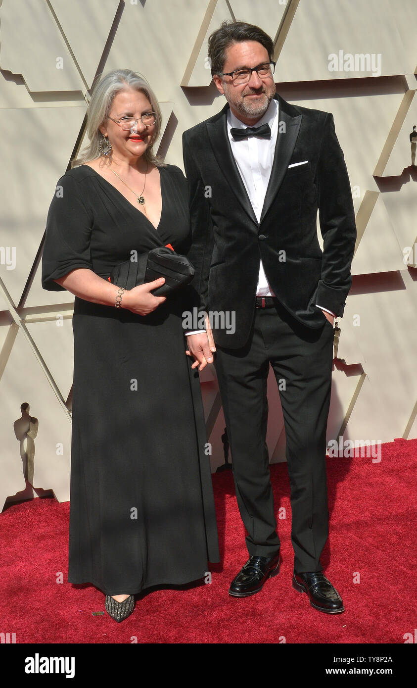 John Casali (R) and Anita Casali arrive on the red carpet for the 91st ...