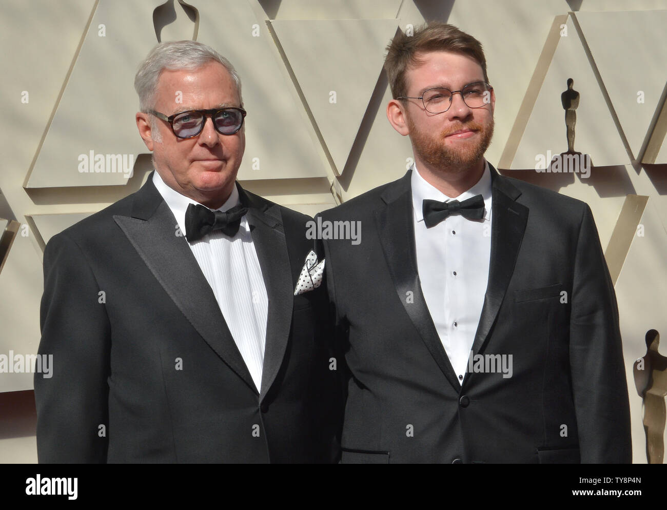 Scott Wittman (L) and guest arrive on the red carpet for the 91st ...