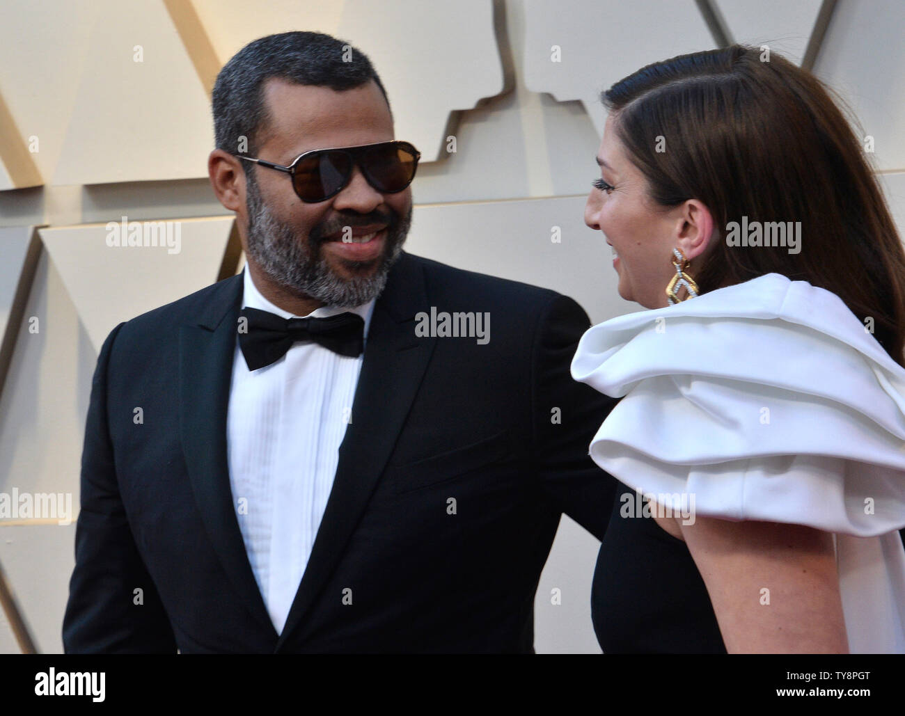 (L-R) Jordan Peele and Chelsea Peretti arrive on the red carpet for the ...