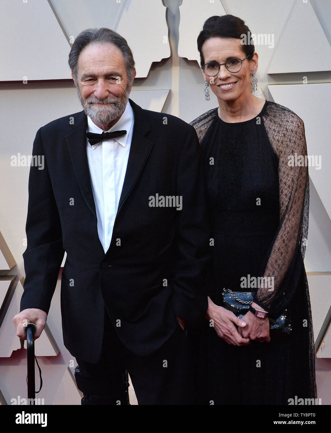 Eric Roth and guest arrive on the red carpet for the 91st annual ...