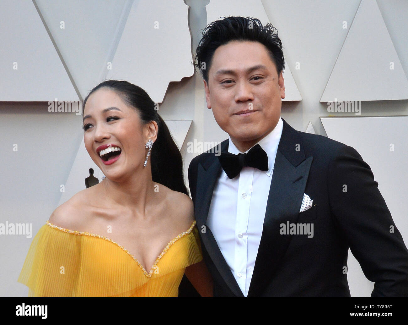 Constance Wu and Jon Chu arrive on the red carpet for the 91st annual ...