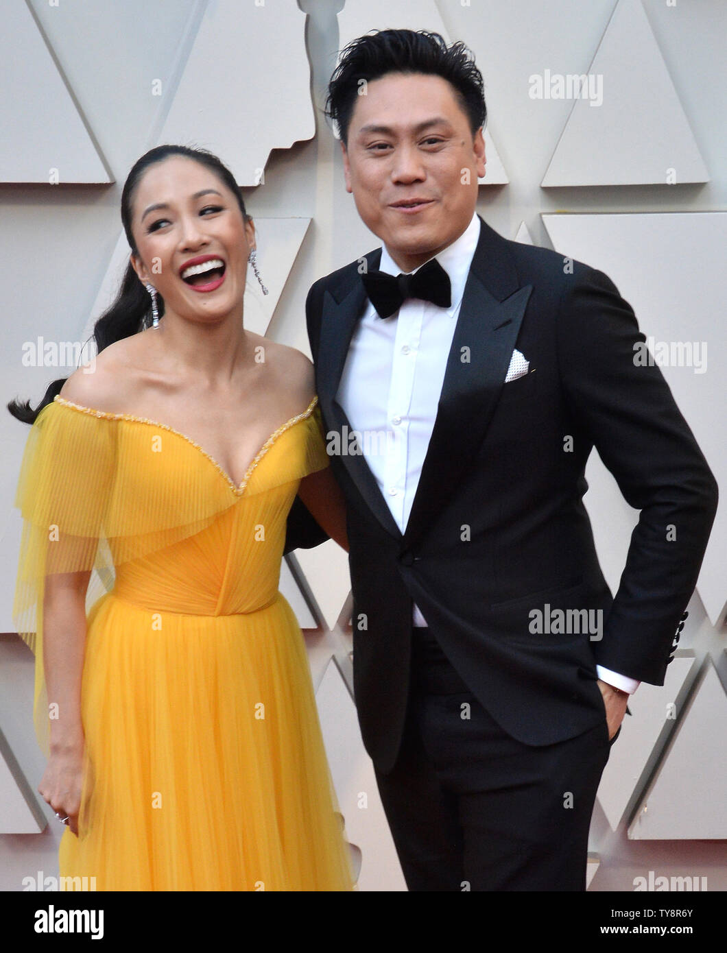 Constance Wu and Jon Chu arrive on the red carpet for the 91st annual ...